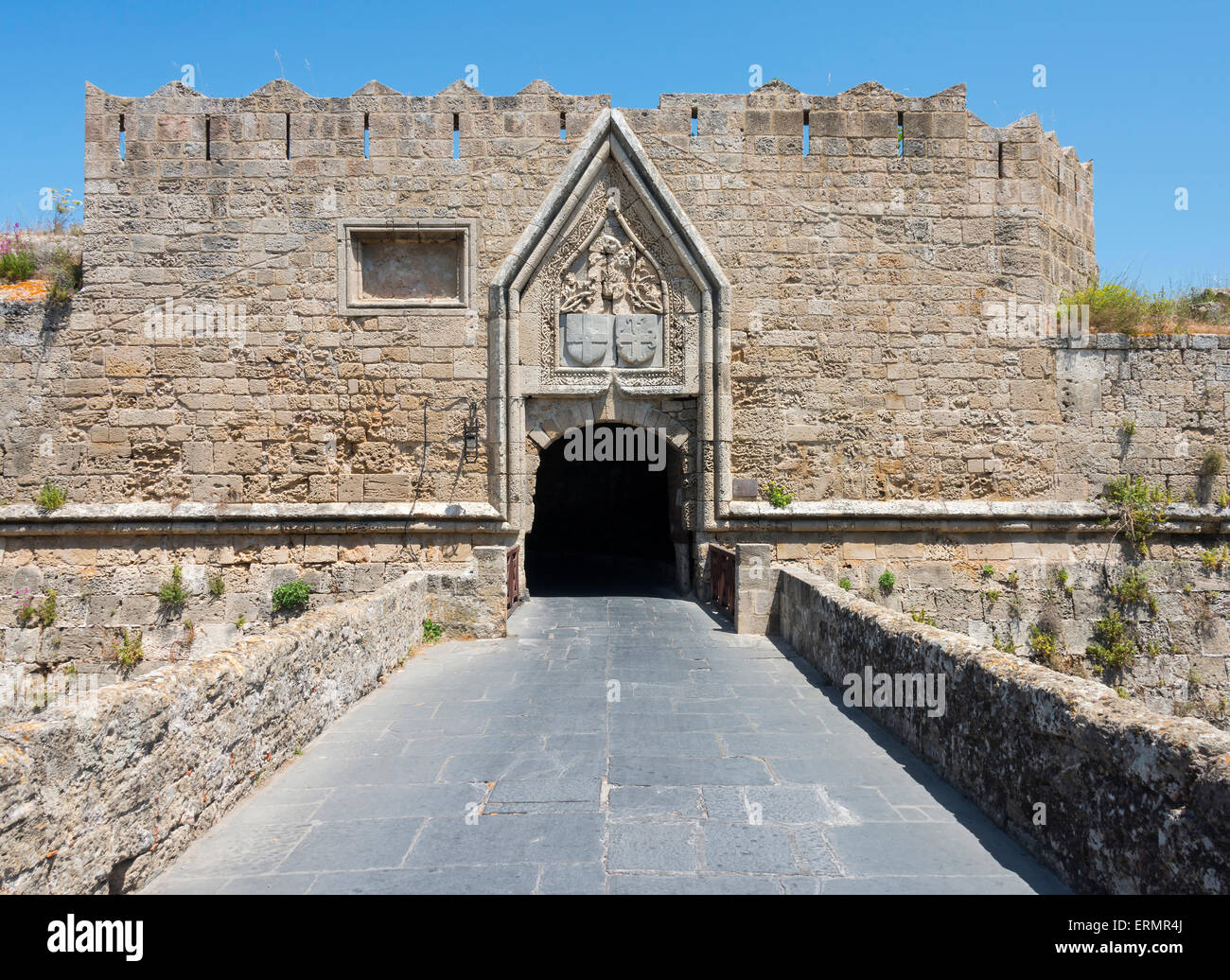 The old medieval castle walls as seen from the moat on the Greek island ...