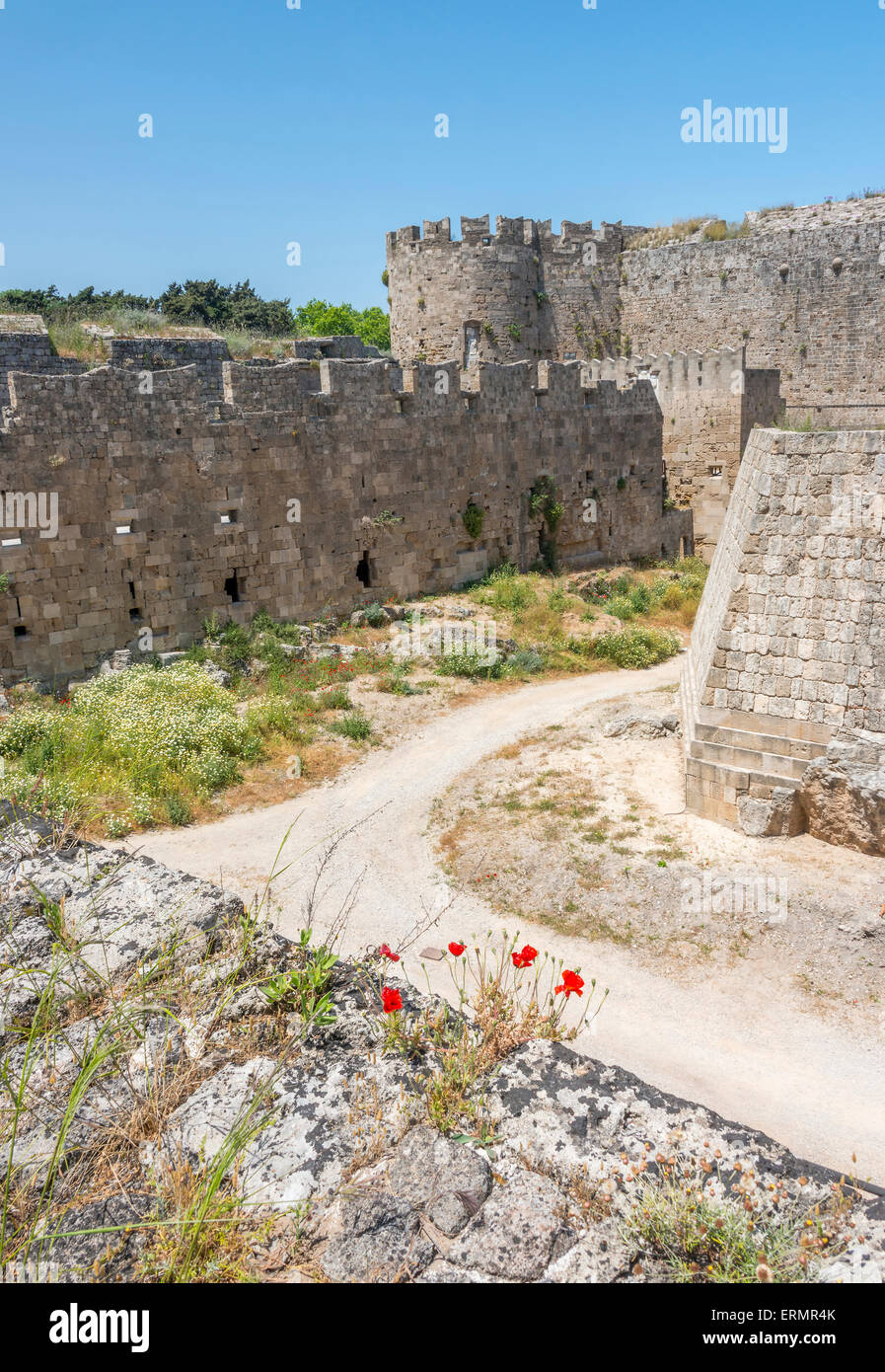 The old medieval castle walls as seen from the moat on the Greek island ...