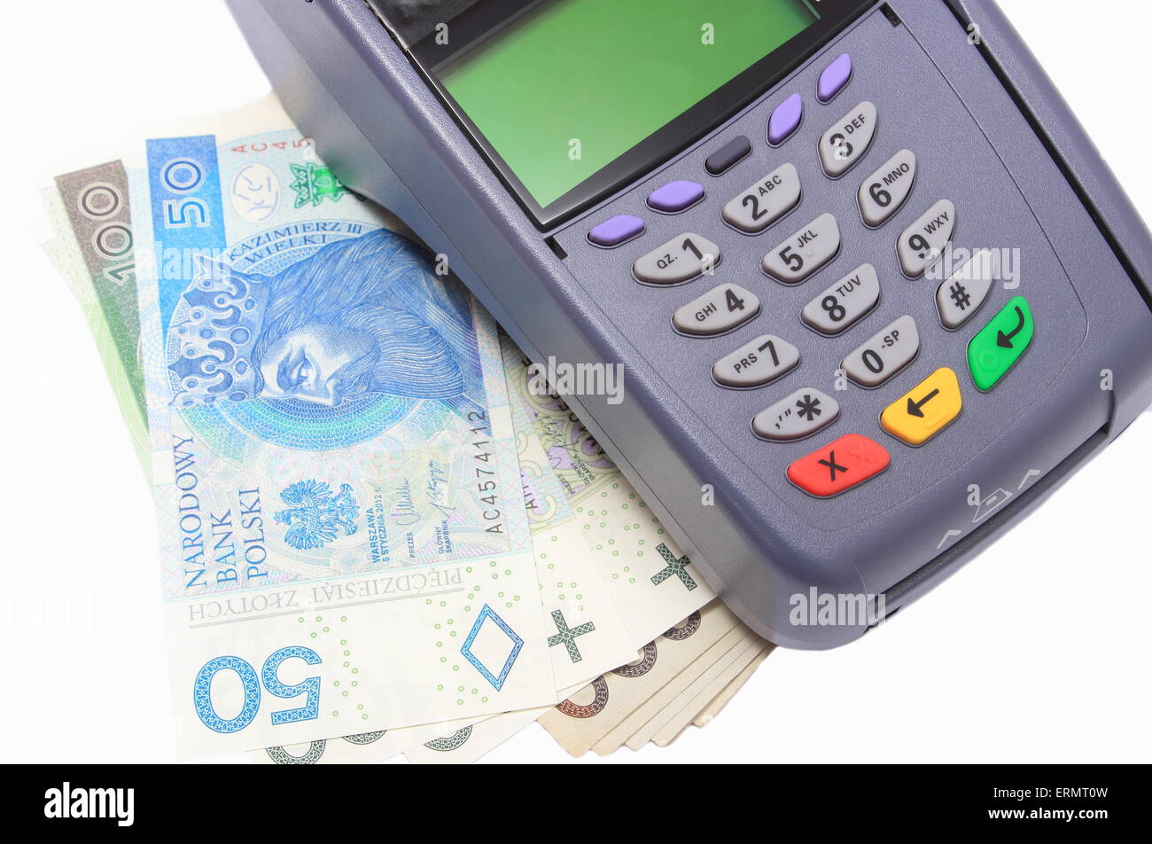 Payment terminal with Polish money on white background, credit card ...