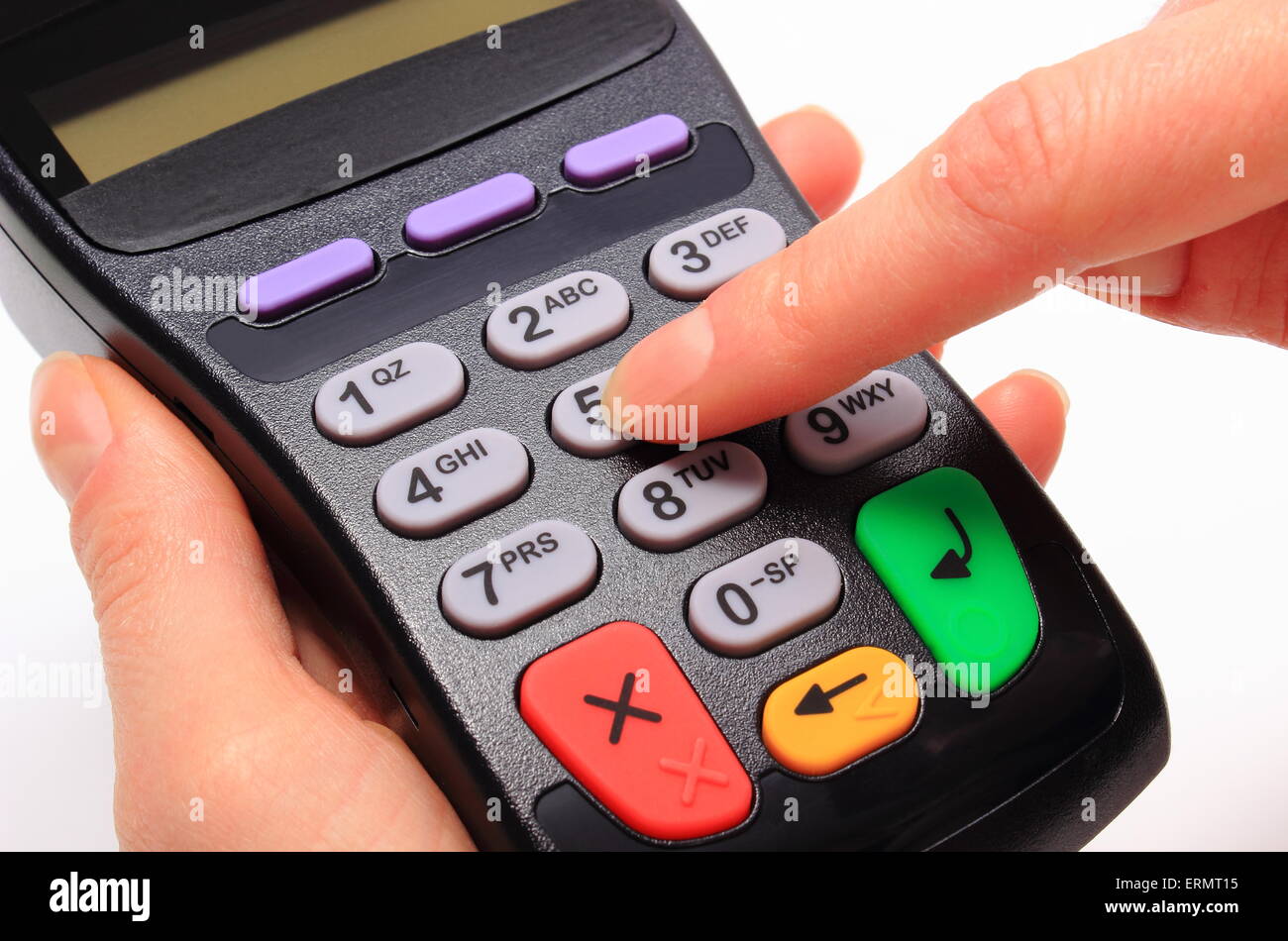 Hand of woman using payment terminal, enter personal identification ...