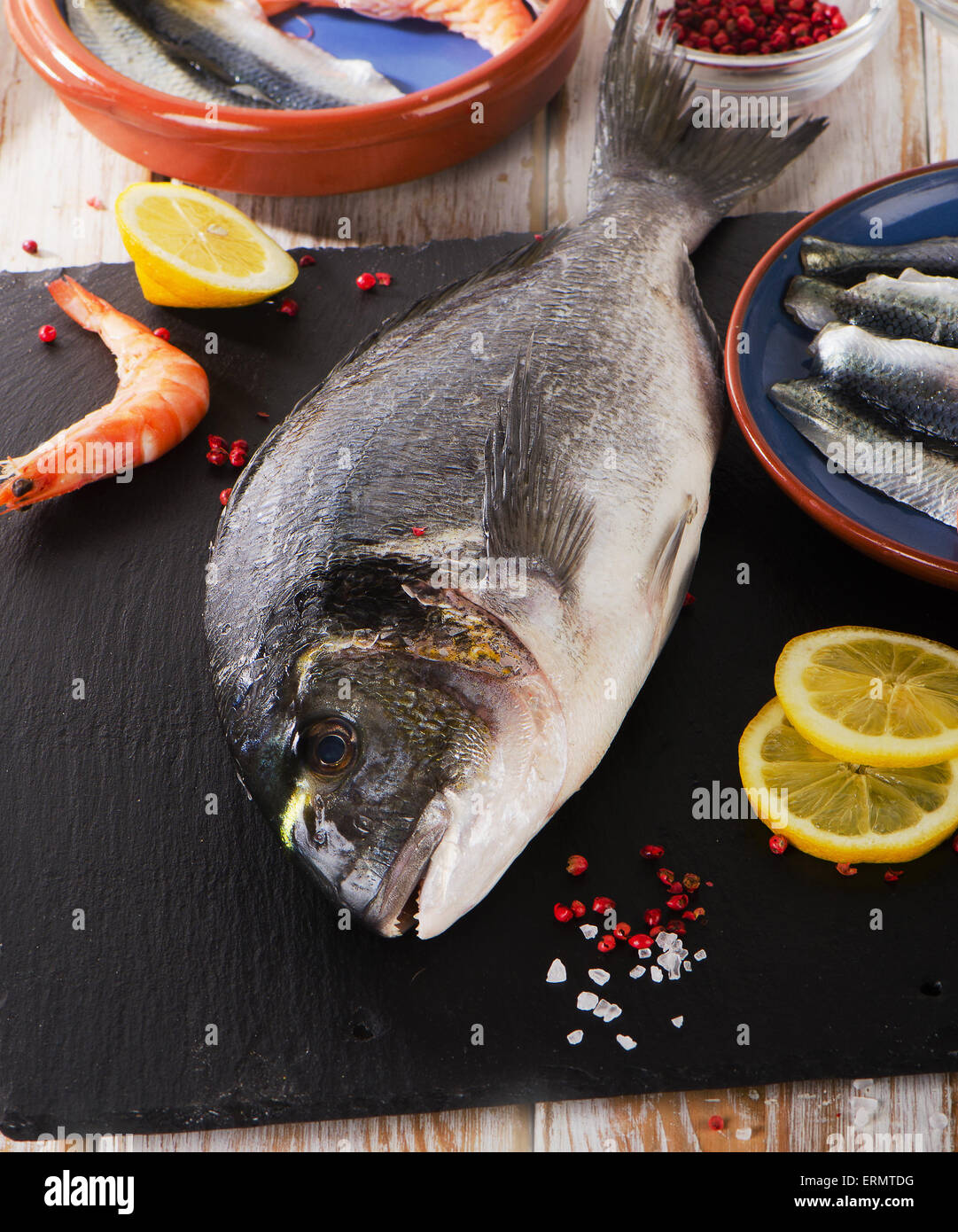 Fresh fish with spices and shrimps - healthy food. Diet concept Stock ...