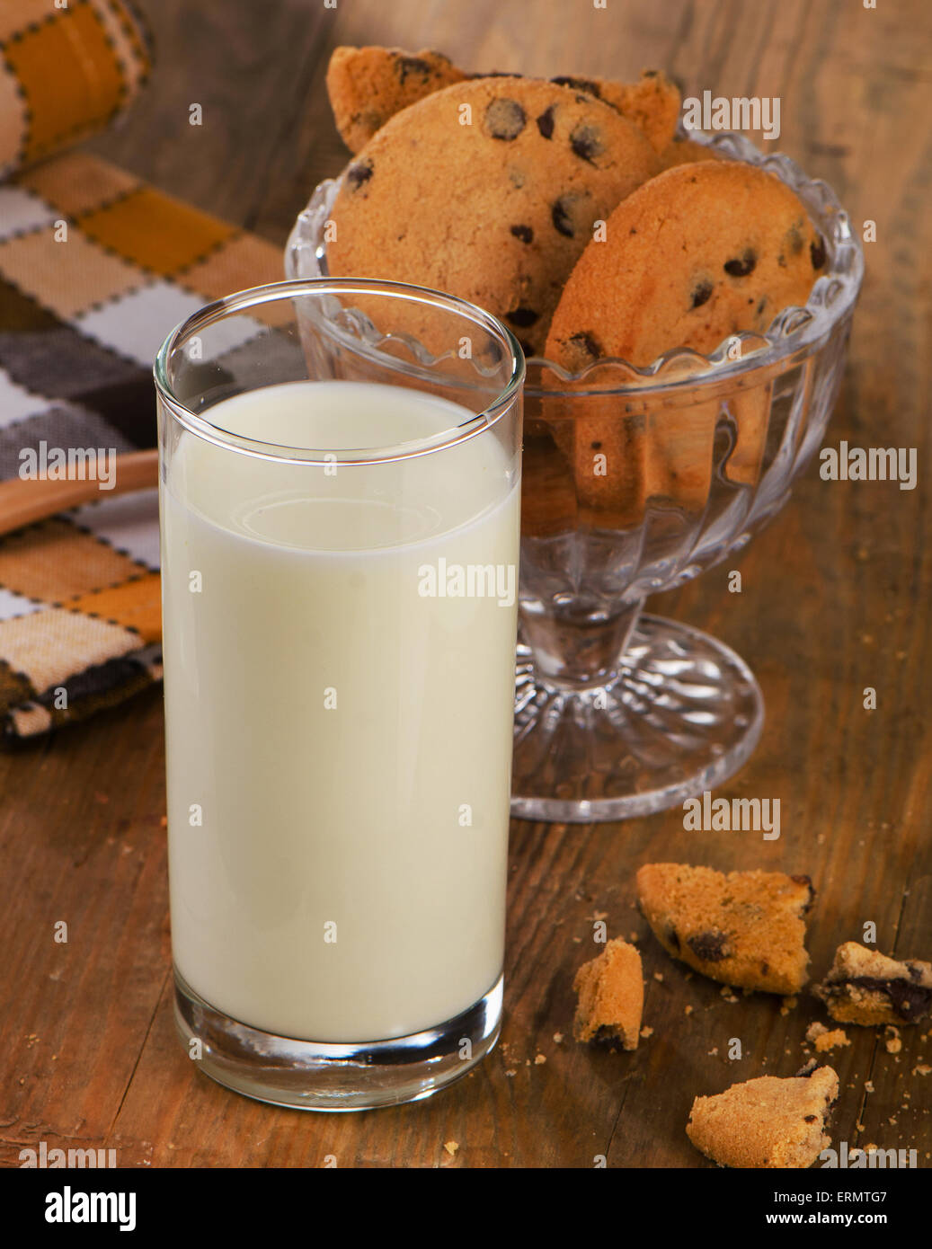 Chocolate chip cookies with milk in glass. Selective focus Stock Photo ...