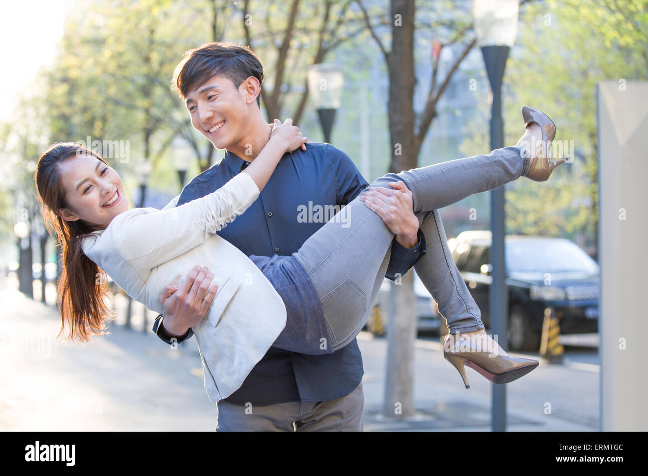 Man carrying girlfriend in arms hi-res stock photography and images - Alamy