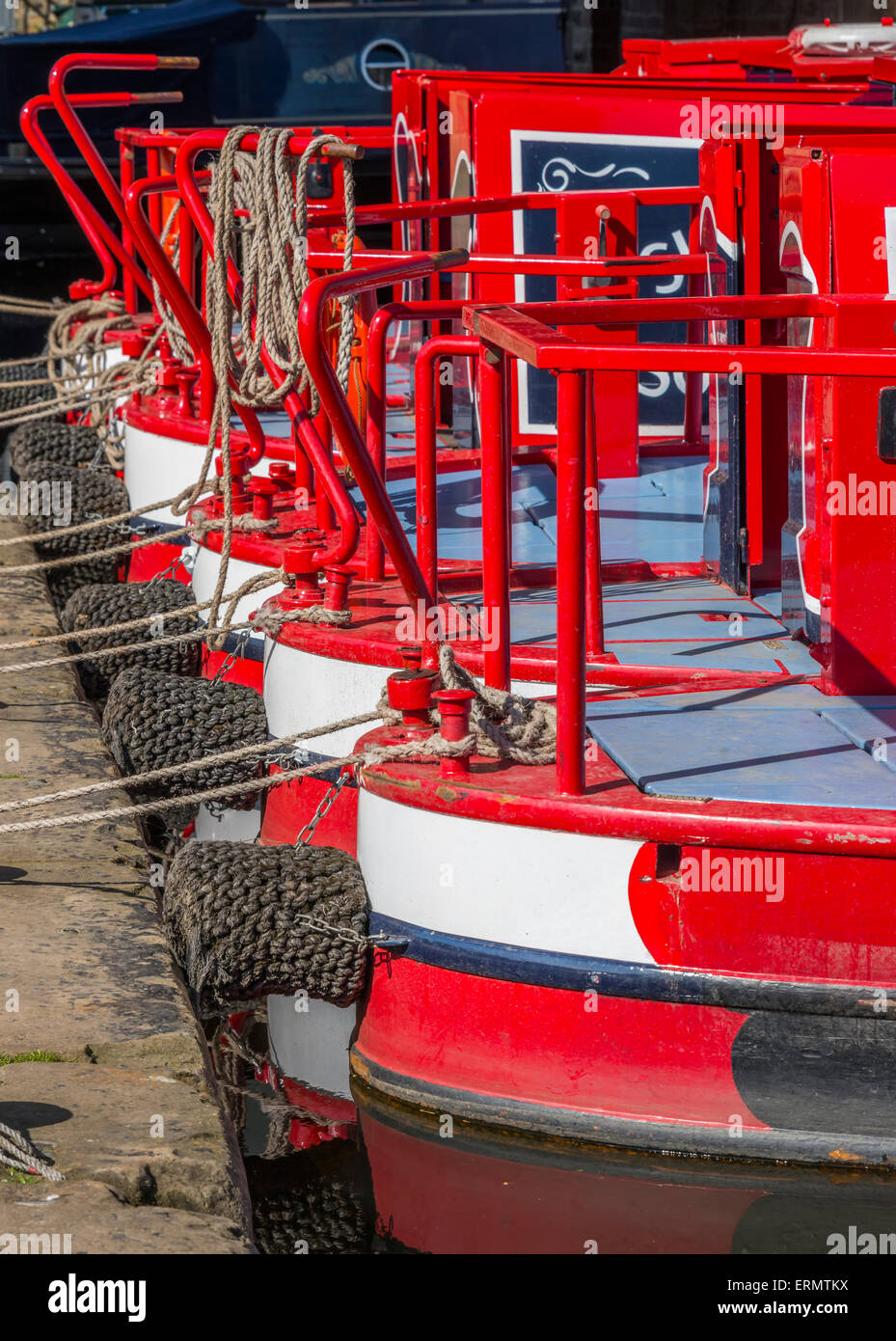 Row of red painted narrowboats Stock Photo - Alamy