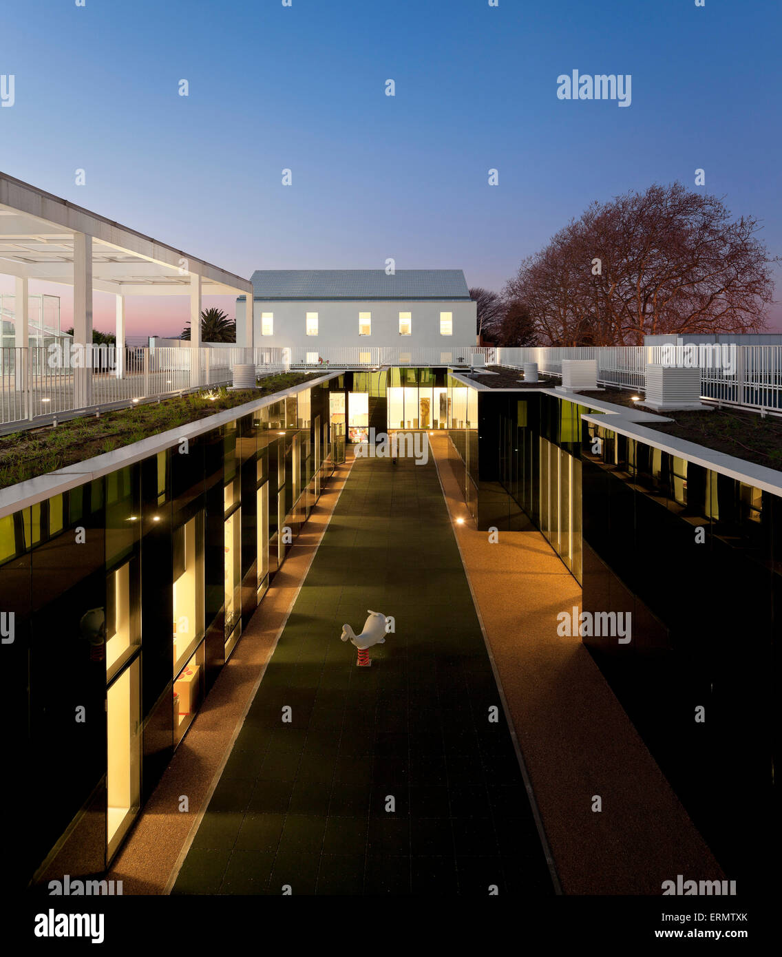 View of inner courtyard at dusk. Center School S.Miguel de Nevogilde ...