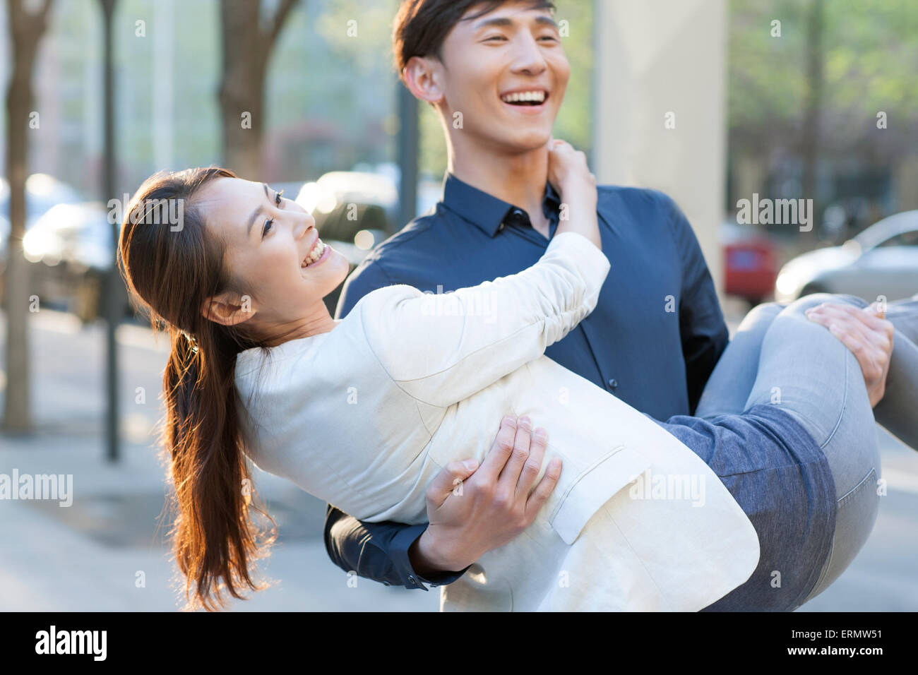 Man Carrying Girlfriend In Arms High Resolution Stock Photography and ...