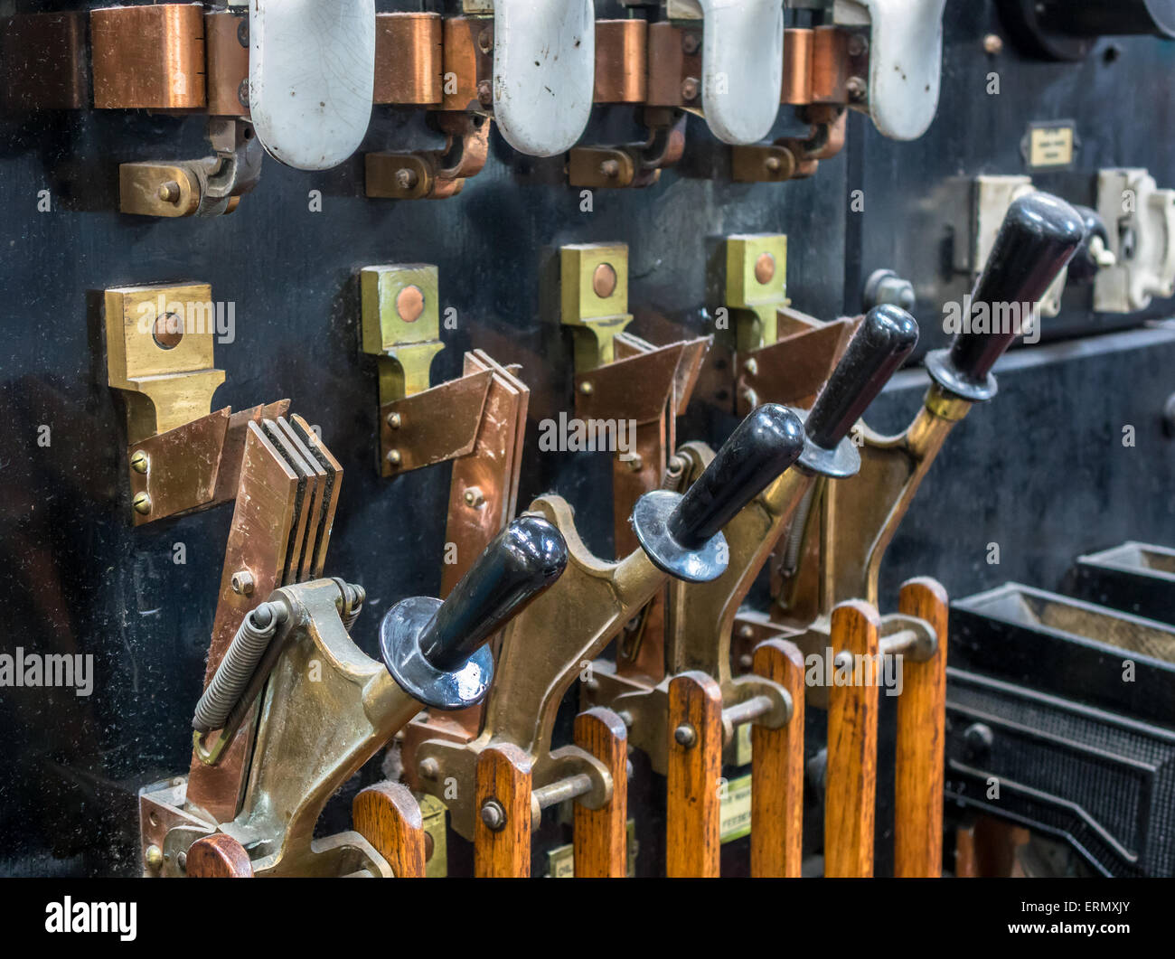 Old industrial copper and wood electrical point levers Stock Photo - Alamy