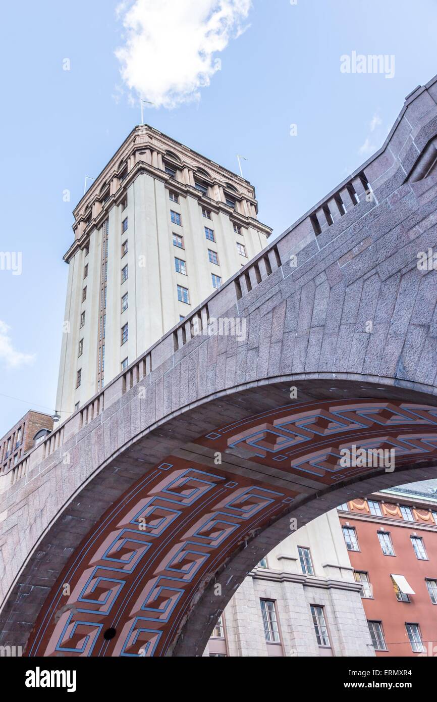 Grey Tower Standing Against Blue Sky With a Painted Bridge in the ...