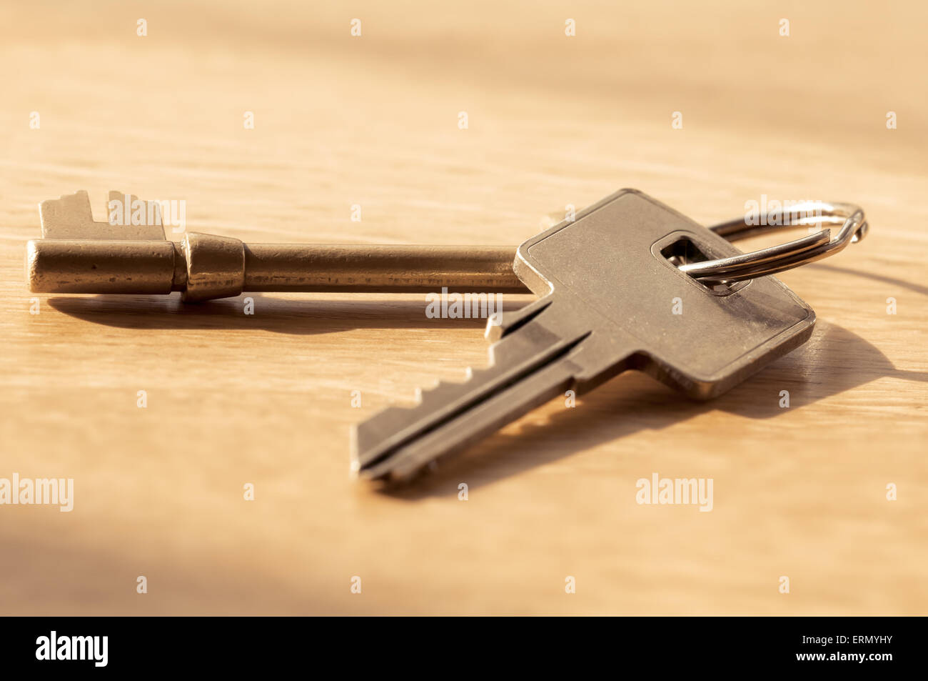 Pair of keys on the table close up Stock Photo - Alamy