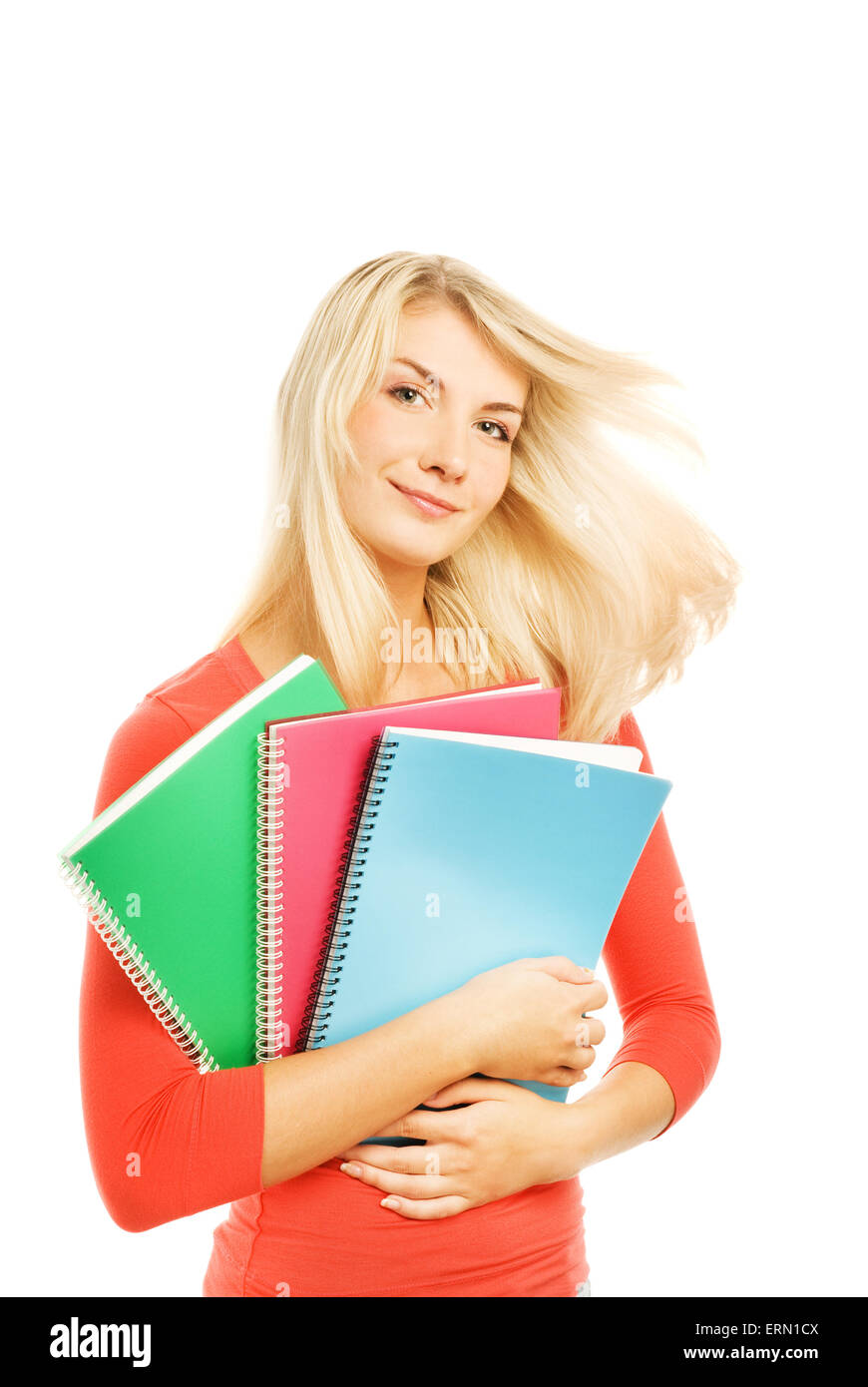 Attractive teenage girl with notebooks isolated on white background ...