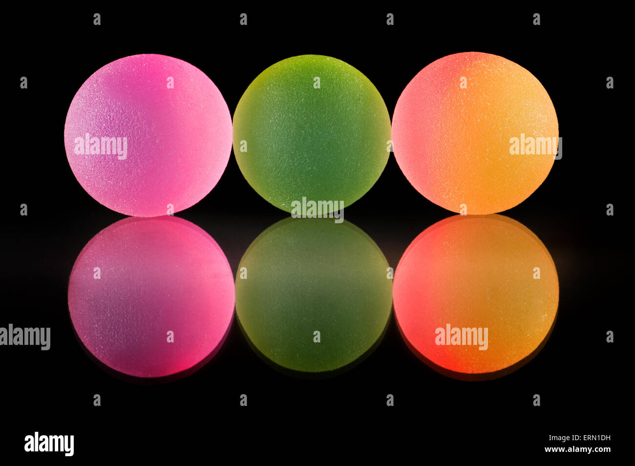 Stylish colorful balls with reflection. Isolated on black background ...