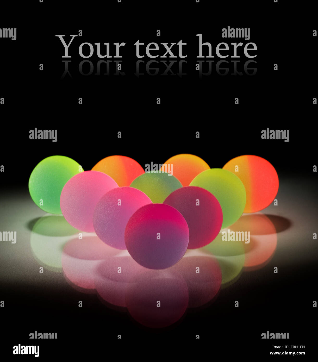 Stylish colorful balls with reflection. Isolated on black background ...