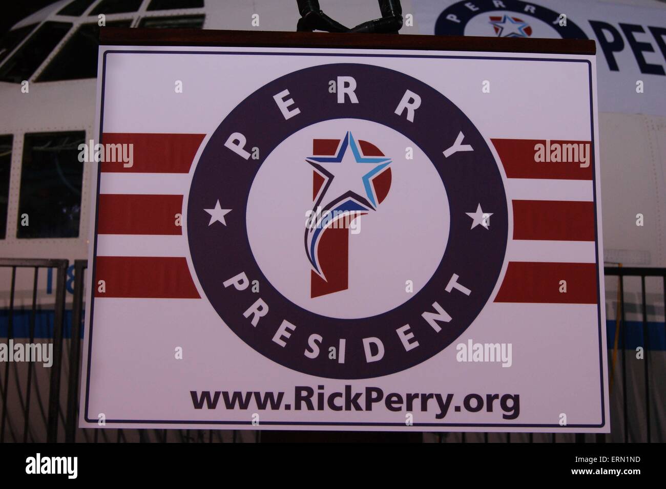 Addison, Texas, USA. 4th June, 2015. Campaign signs and a C-130 ...