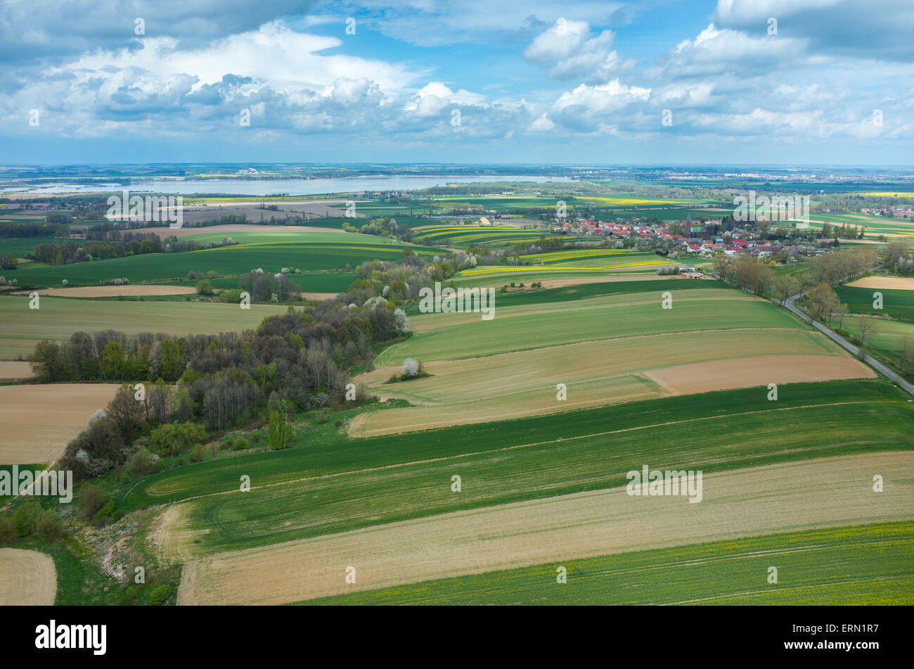 Aerial view on a small village surrounded by green fields Stock Photo ...