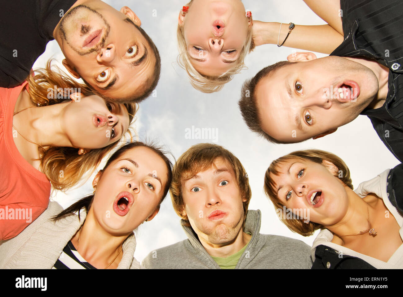 Group of happy friends making surprised faces Stock Photo - Alamy