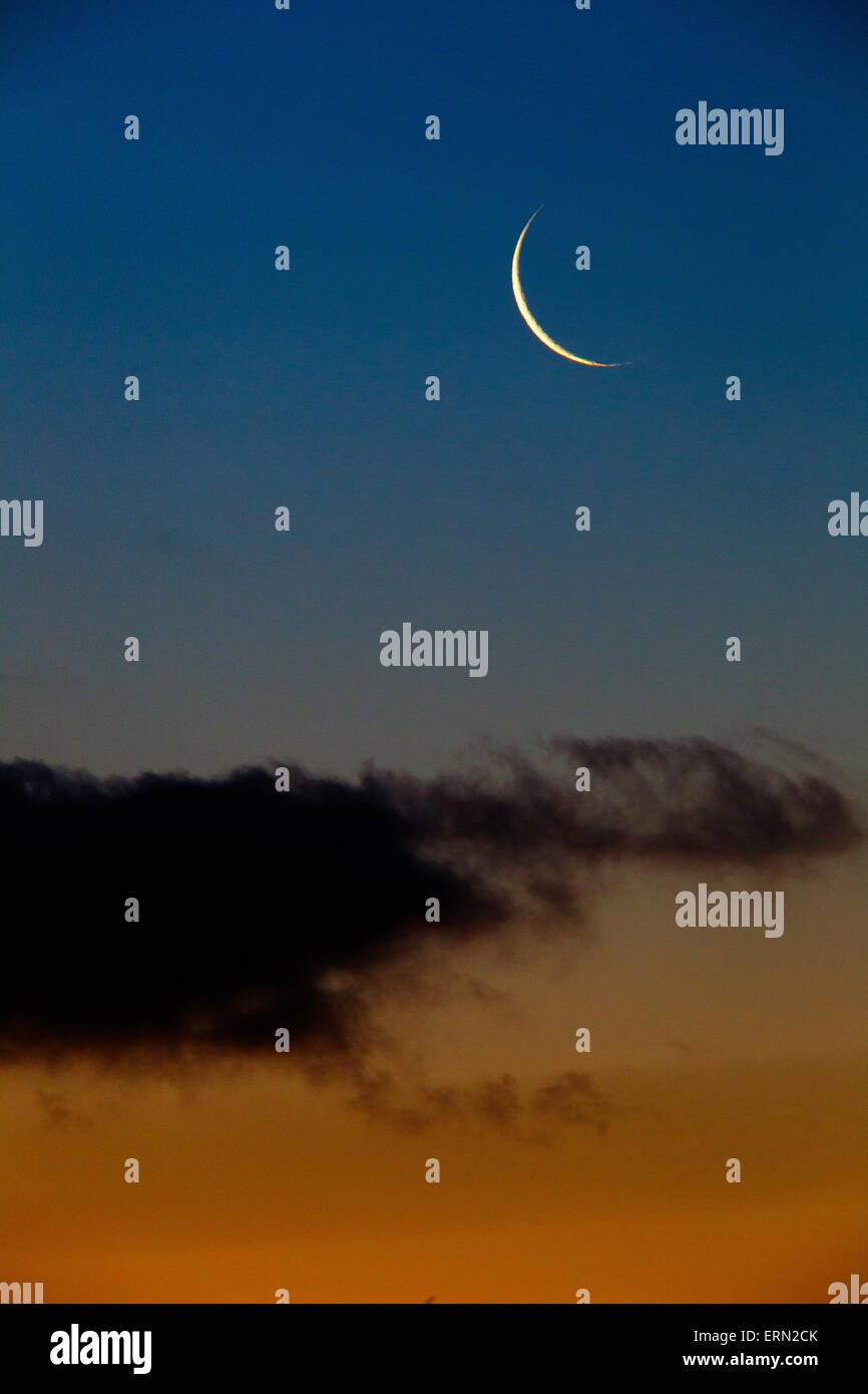Crescent Moon in a dawn sky.sunrise Stock Photo - Alamy