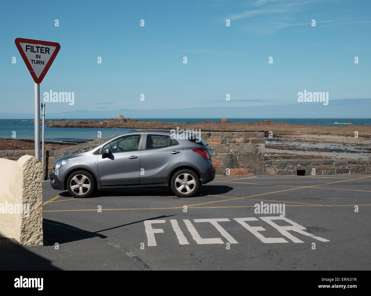 Guernsey filter in turn road system Stock Photo - Alamy