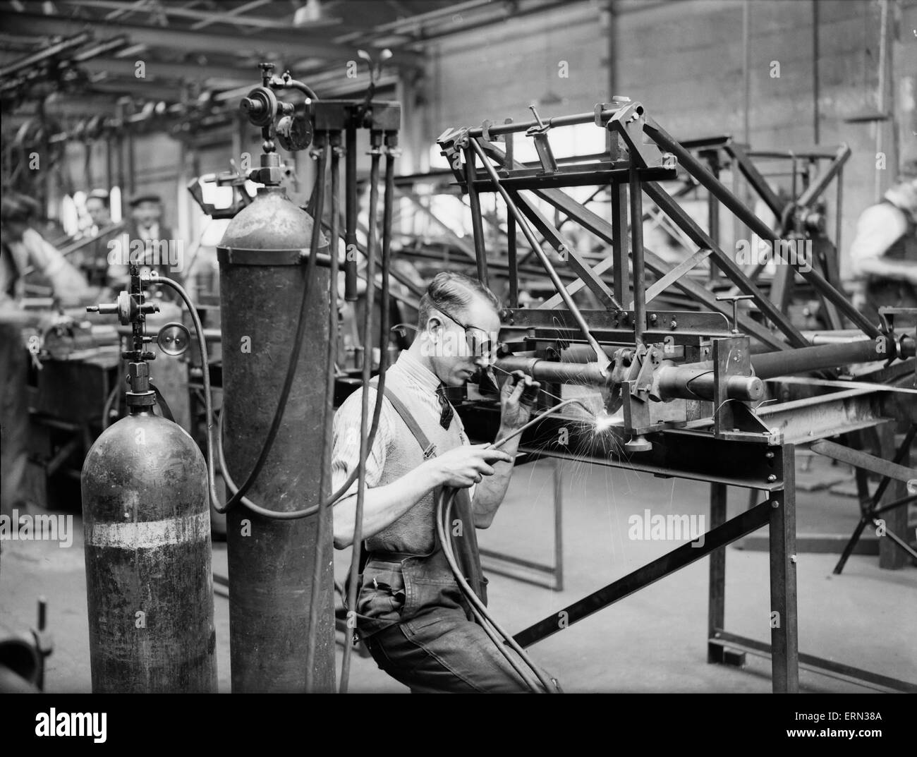 A welder constructs the fuselage framework of the Miles 3 Falcon ...