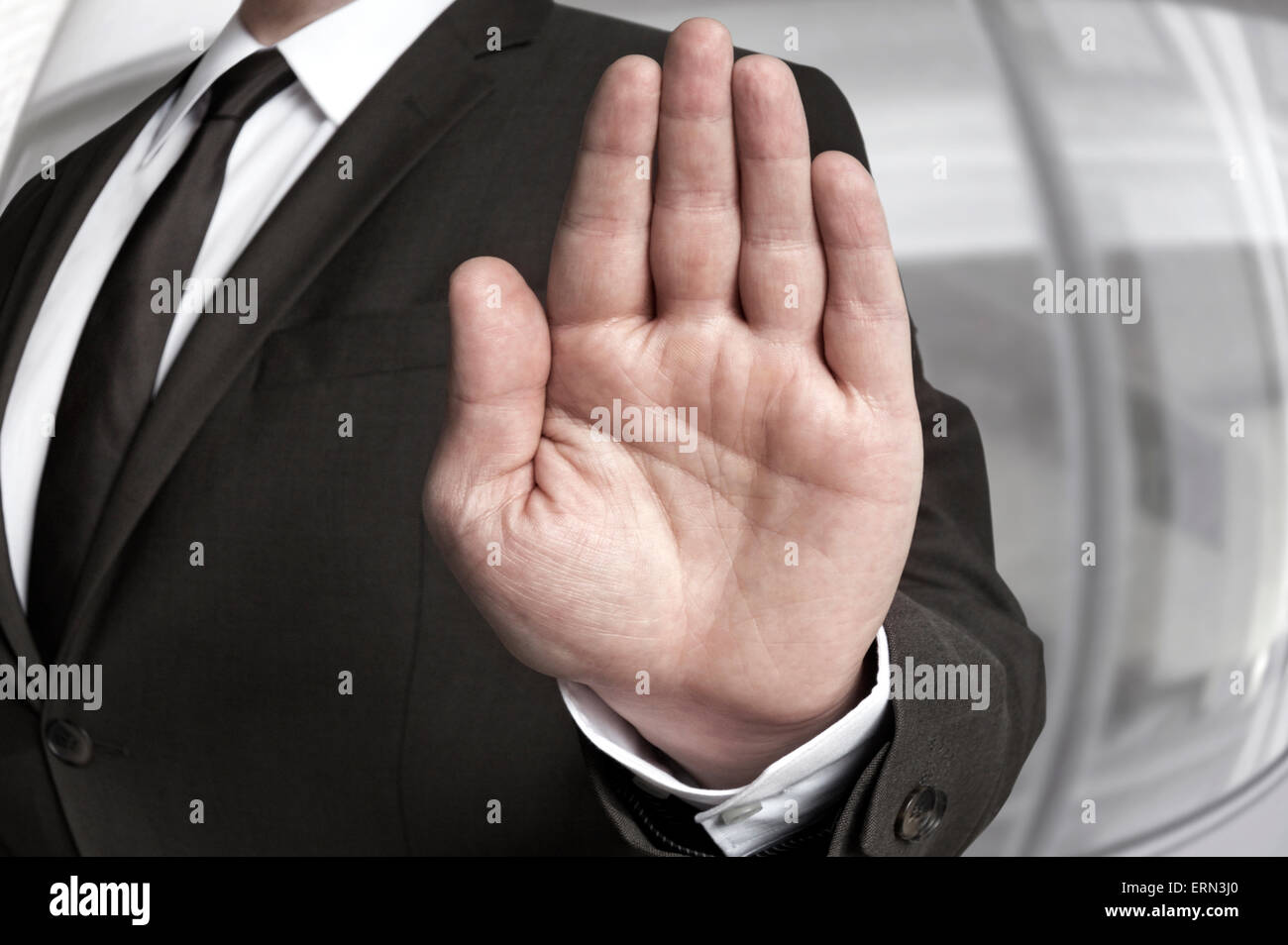 Hand stop shown by businessman Stock Photo - Alamy