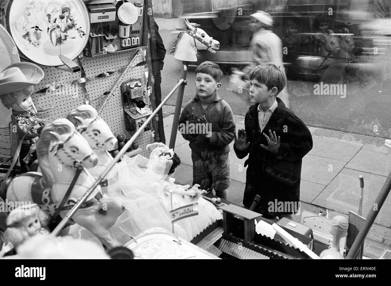 Children look longingly at toys into shop window at Christmas, 16th ...