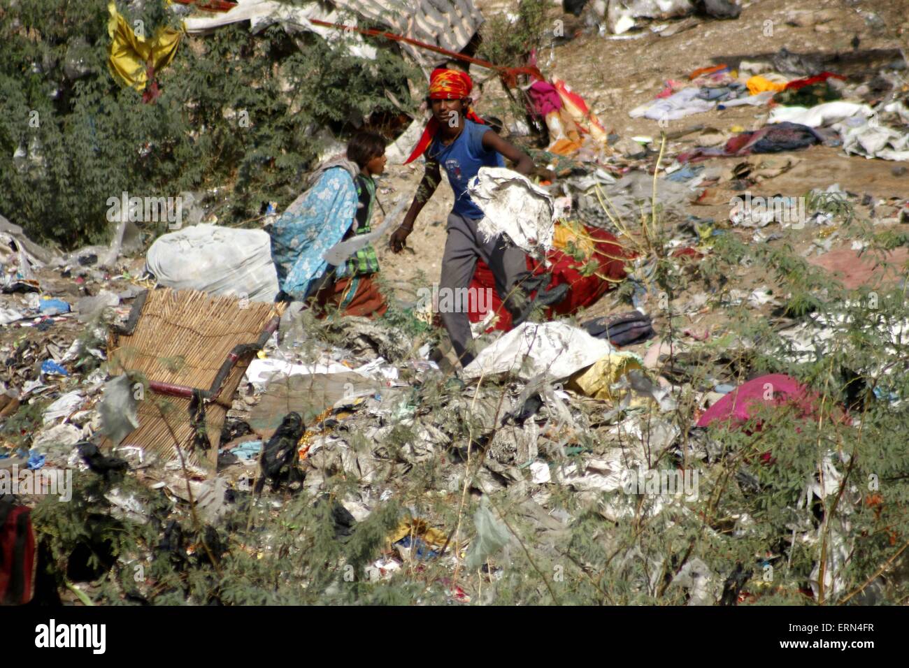 Indian rag pickers scour dumps during the World Environment Day in ...