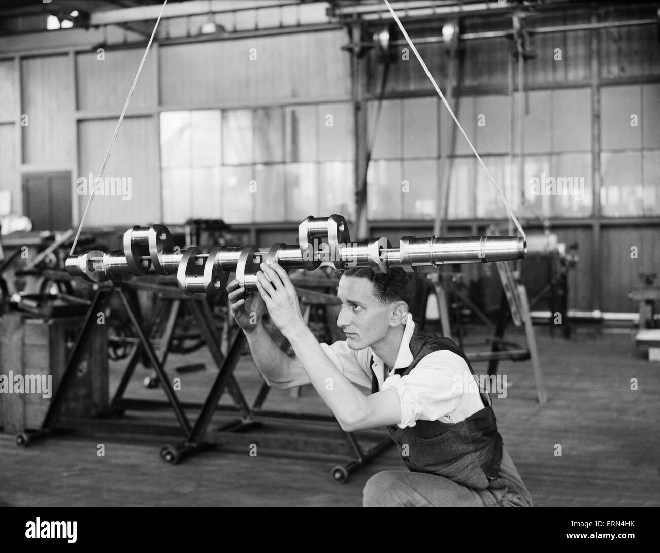 Engineer examines the prop shaft of the Gipsy Six engine during the ...