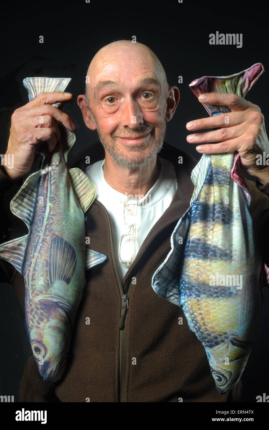 Great friendly giant caught two fish Stock Photo - Alamy