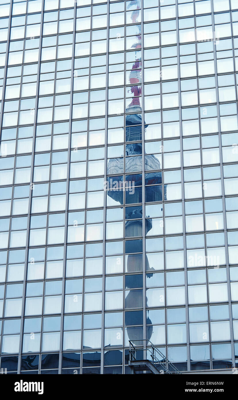 The facade of a skyscraper with reflection television tower in Berlin ...
