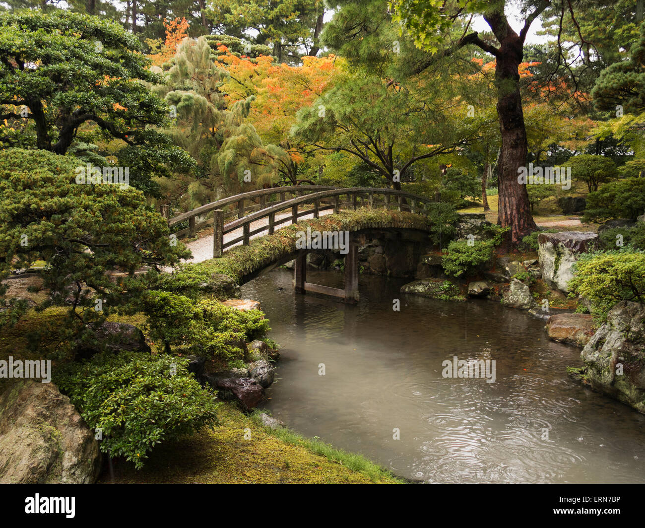 Japanese stone bridge across a stream in a park; Kyoto, Japan Stock ...