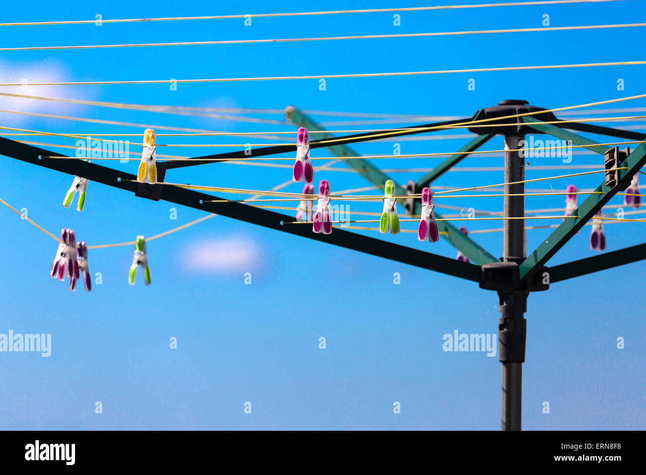 clothes pegs on rotary washing line Stock Photo - Alamy