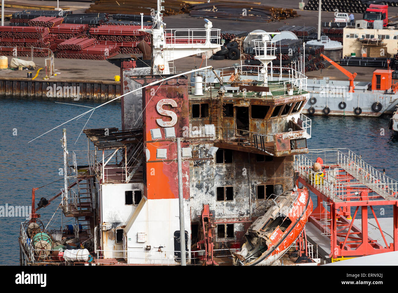 Fire damaged cargo ship. Berthed Aqaba Jordan Middle East Stock Photo ...