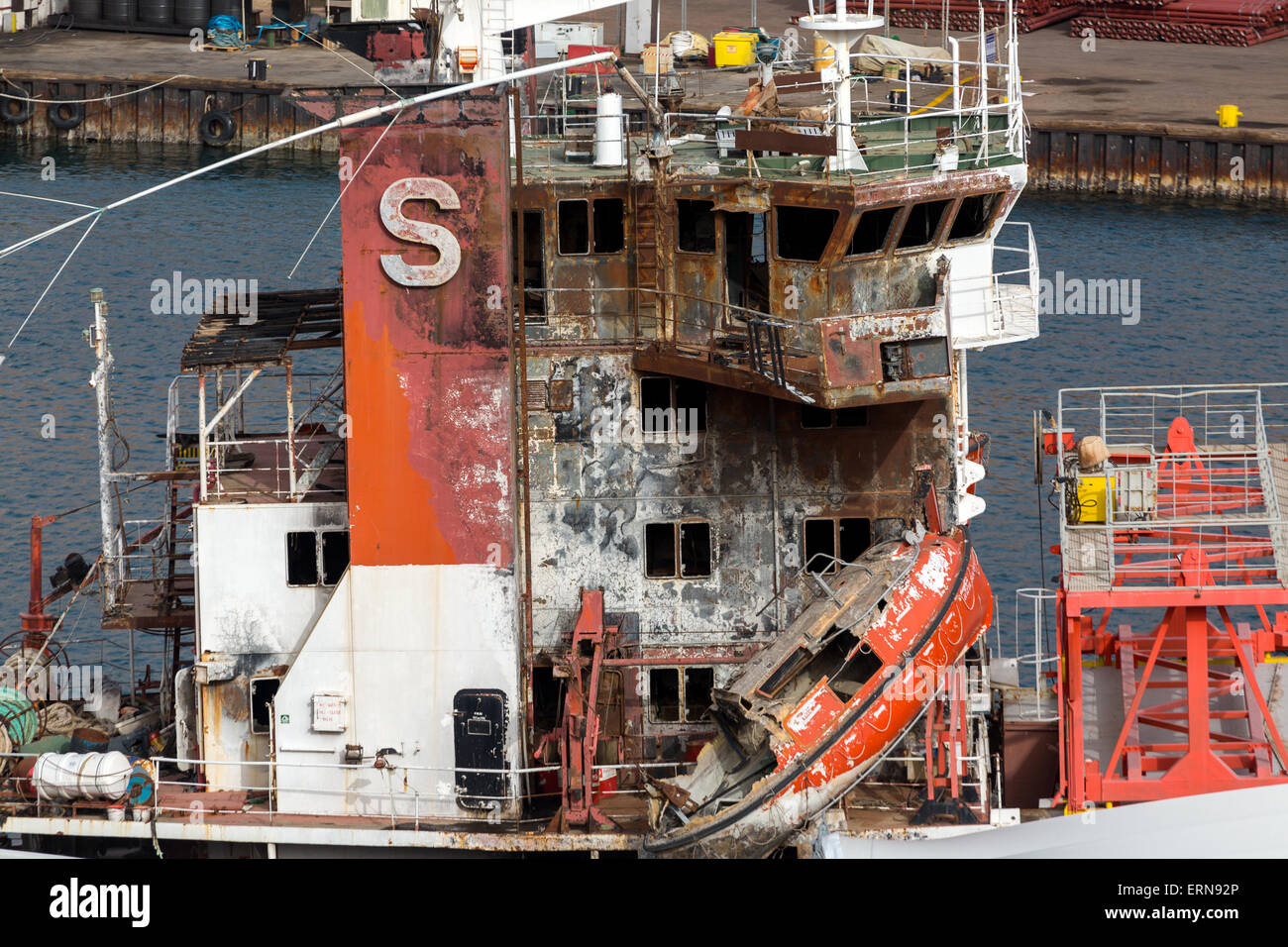 Fire damaged cargo ship. Berthed Aqaba Jordan Middle East Stock Photo ...