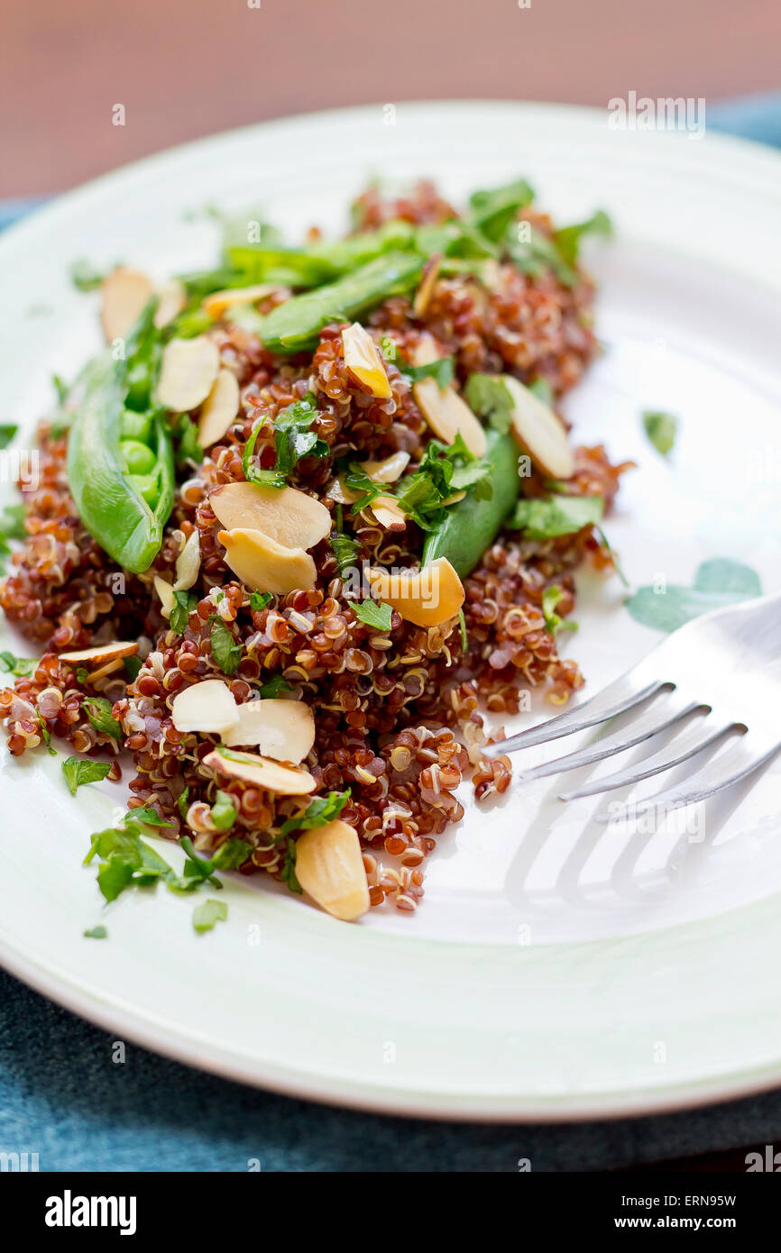 Healthy nutty red quinoa salad with sugar snap peas sliced toasted ...