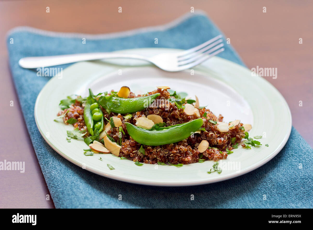 Healthy nutty red quinoa salad with sugar snap peas sliced toasted ...