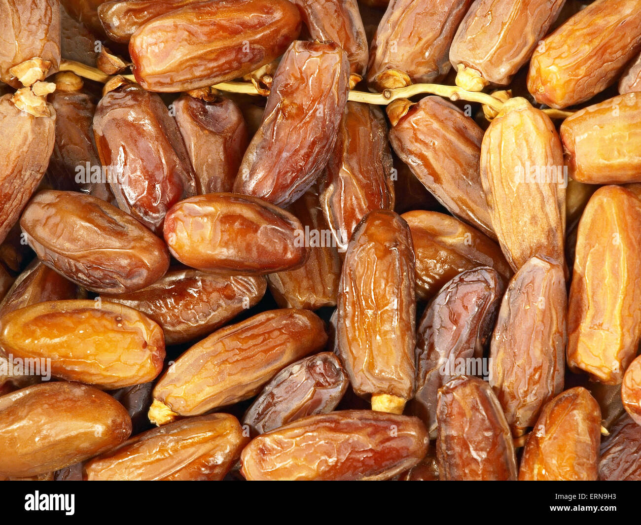 Fresh dates taken closeup as background Stock Photo - Alamy
