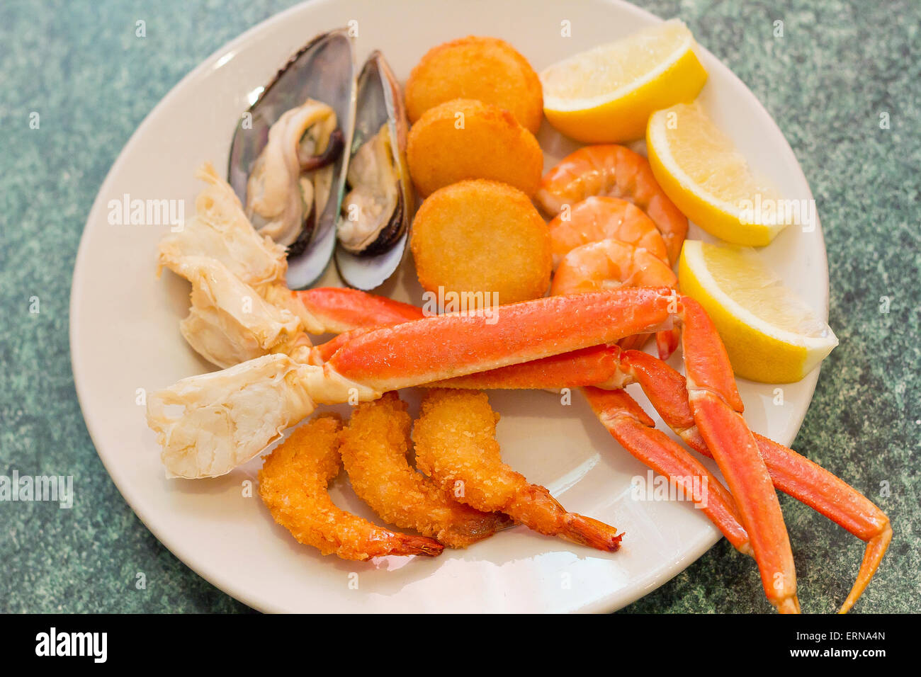 Seafood medley including crab legs breaded shrimp muscles and fried ...