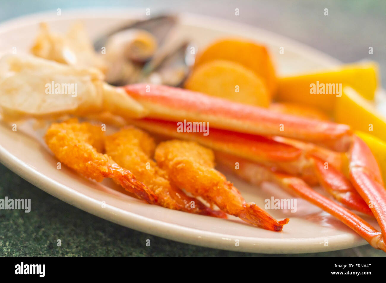 Seafood medley including crab legs breaded shrimp muscles and fried ...