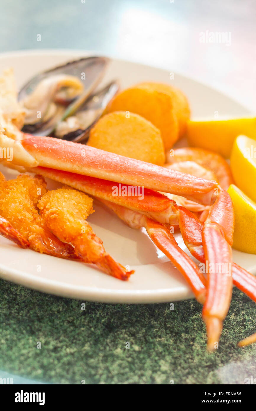 Seafood medley including crab legs breaded shrimp muscles and fried ...