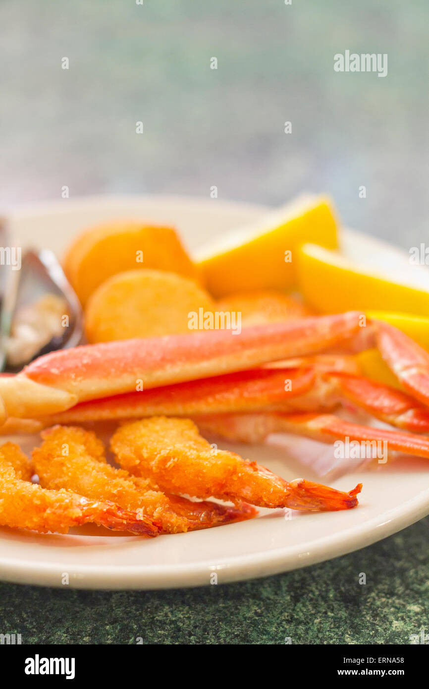 Seafood medley including crab legs breaded shrimp muscles and fried ...