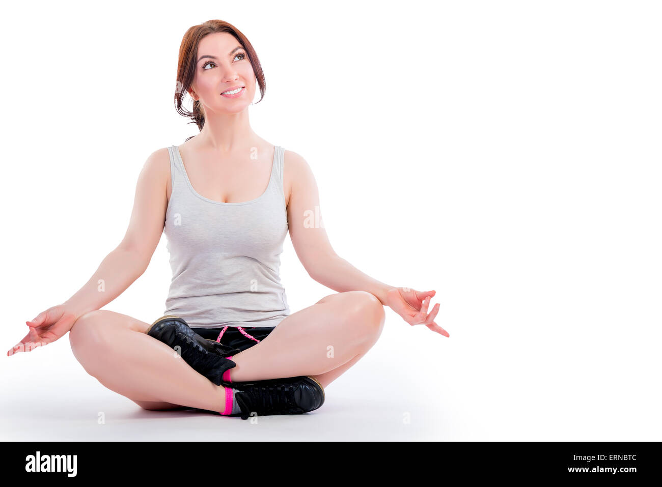 attractive girl in the lotus position on a white background Stock Photo ...
