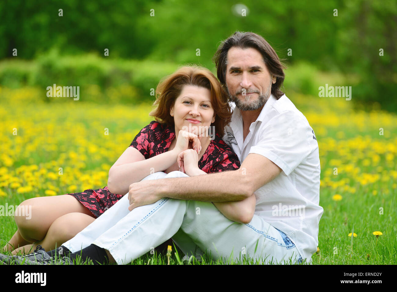 Adult male and female in a park in spring Stock Photo - Alamy