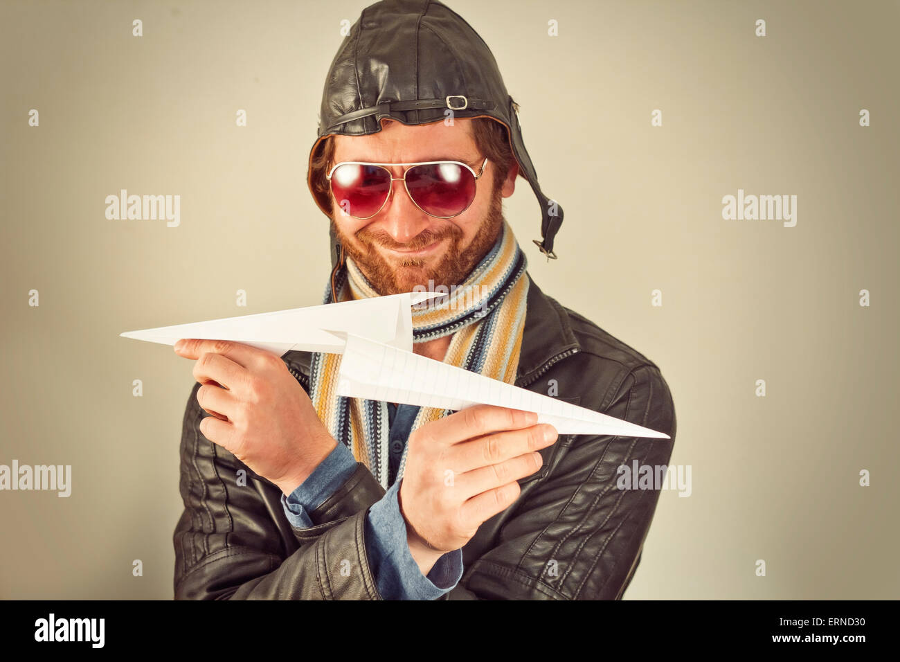 Aviator pilot with hat and sunglasses plays with paper planes Stock ...