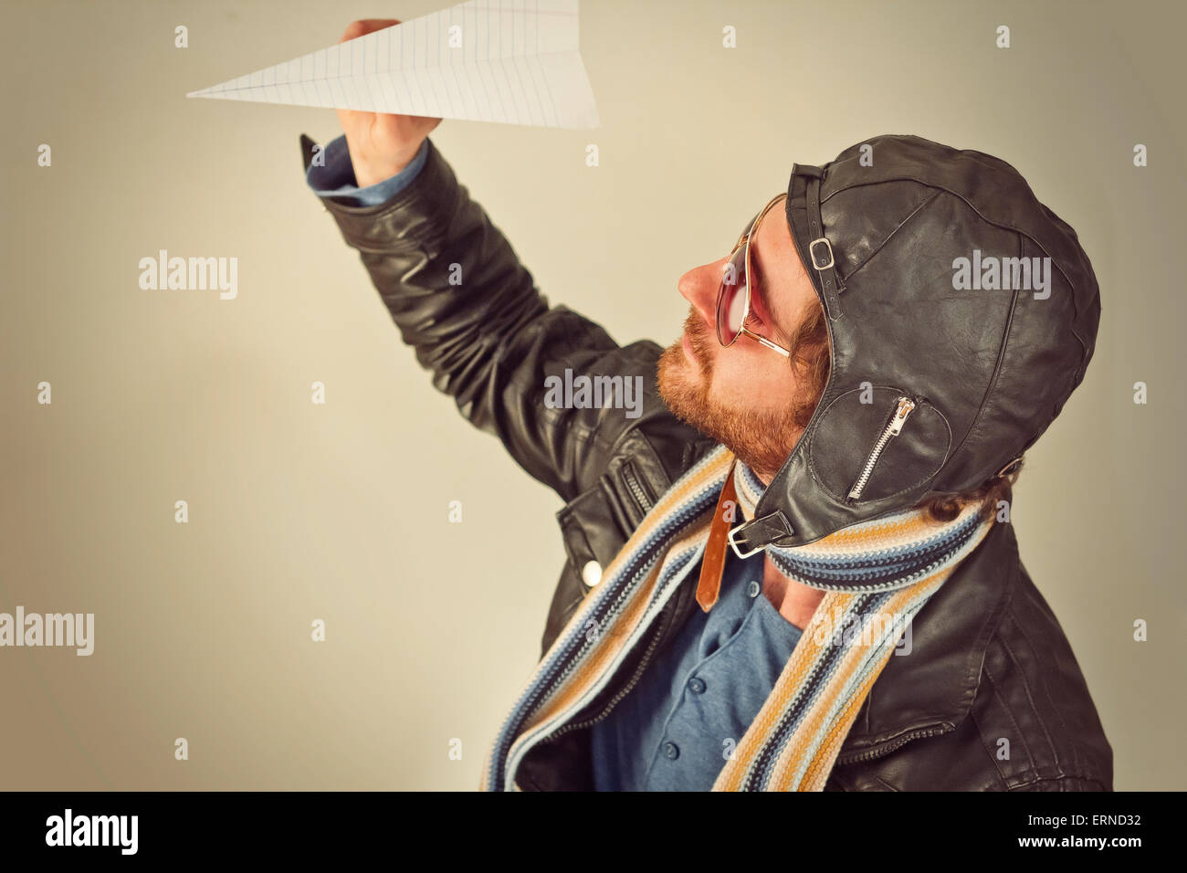 Aviator pilot with hat and sunglasses plays with paper planes Stock ...