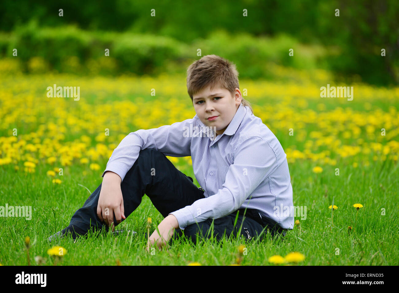 A teenager Boy in the spring park Stock Photo - Alamy