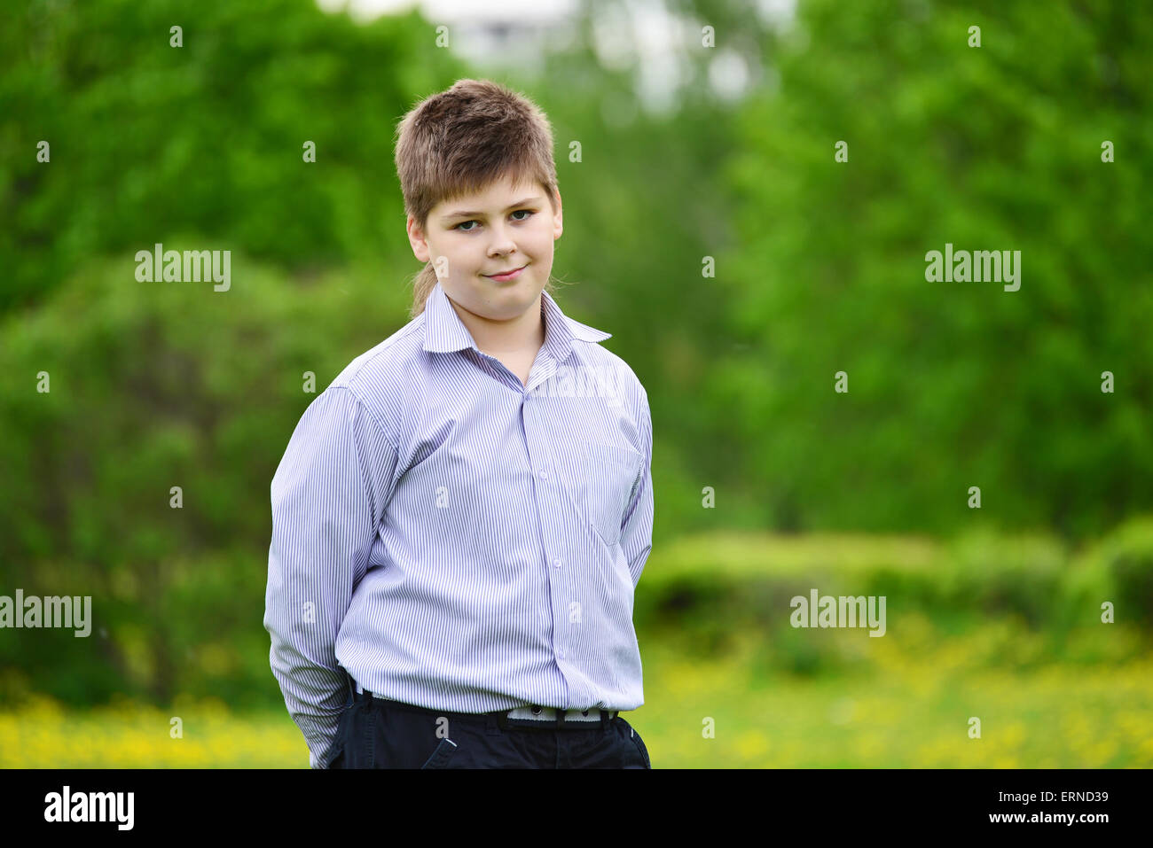 A teenager Boy in the spring park Stock Photo - Alamy