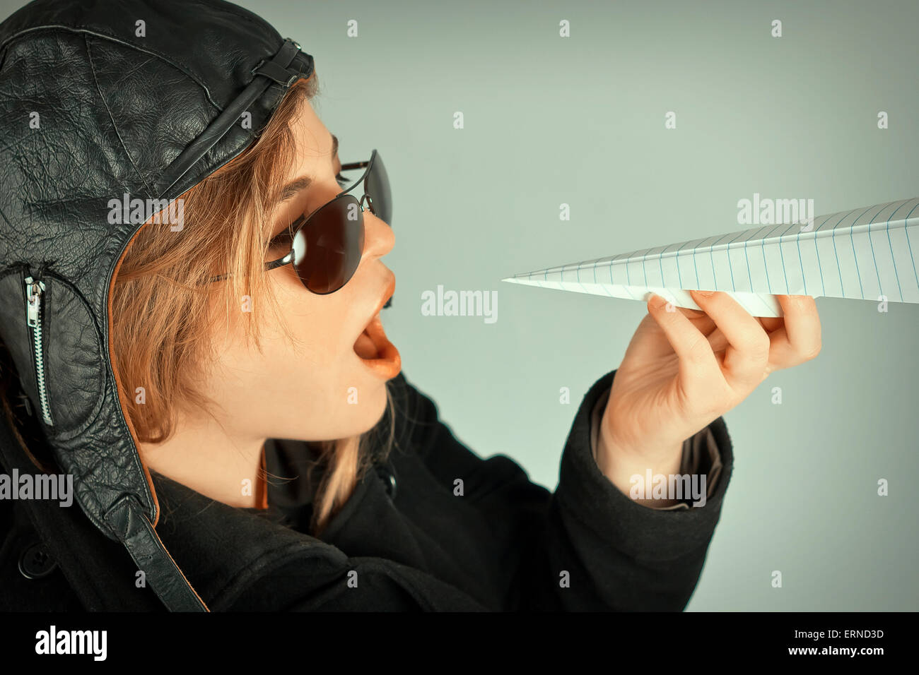 Aviator pilot with hat and sunglasses plays with paper planes Stock ...