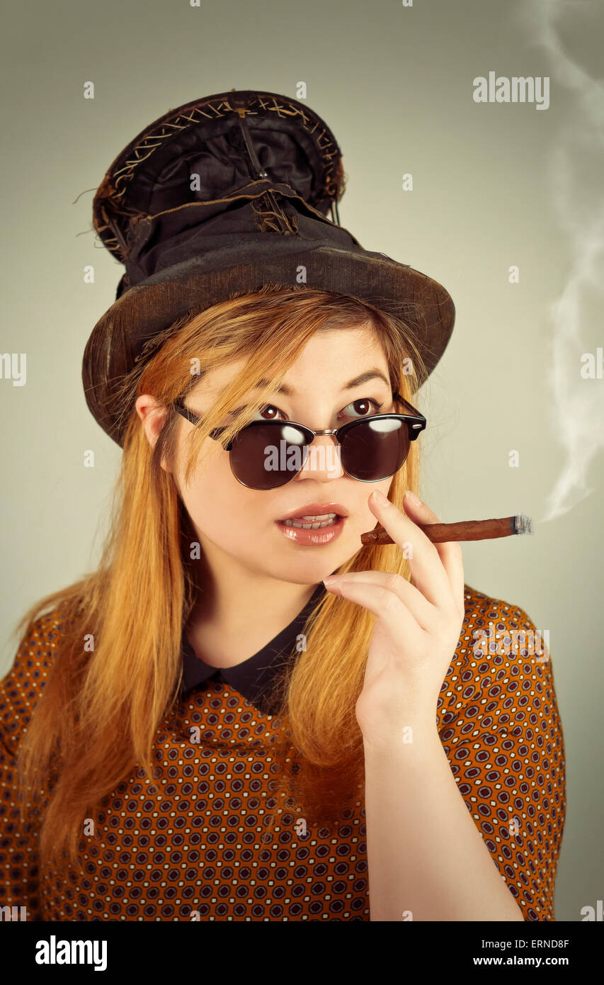 Tramp girl wears old top hat in vintage photo style Stock Photo - Alamy