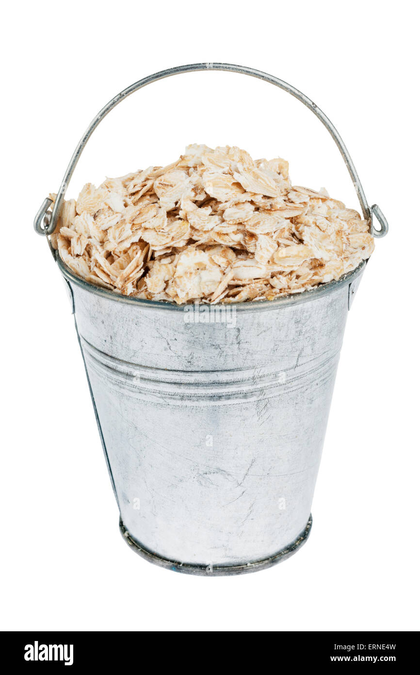 Bucket with oat flakes, isolated on white background Stock Photo - Alamy