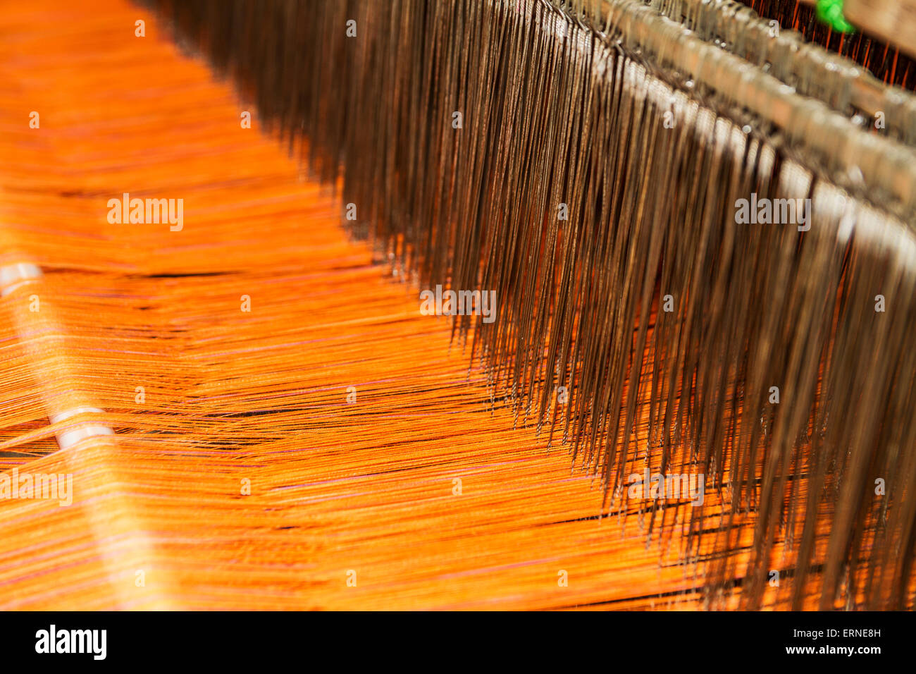 Traditional Lurik cloth being woven on a loom in a lurik workshop in ...