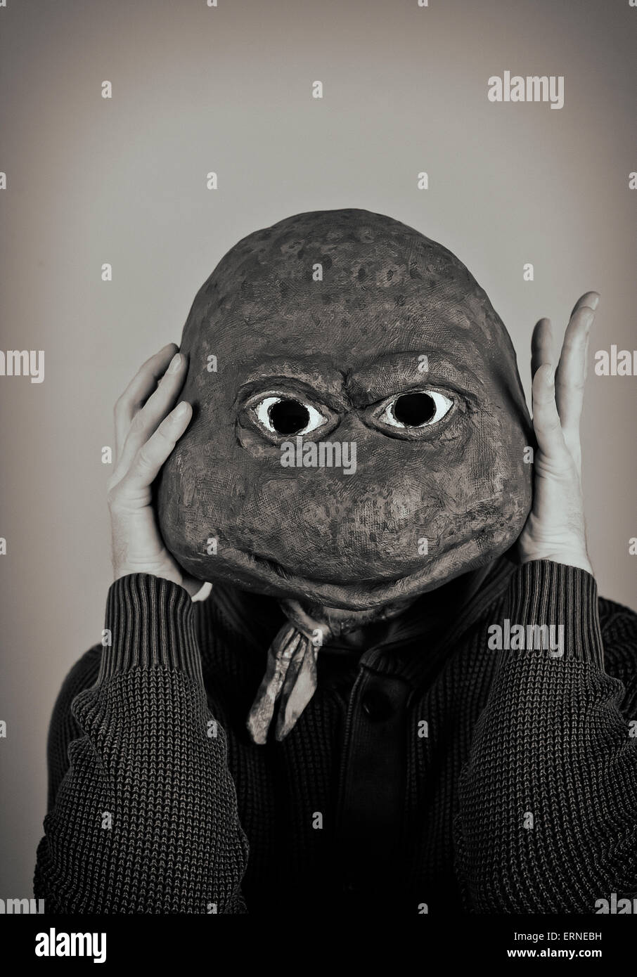 Creepy bald lizard man wearing a blue sweater Stock Photo - Alamy